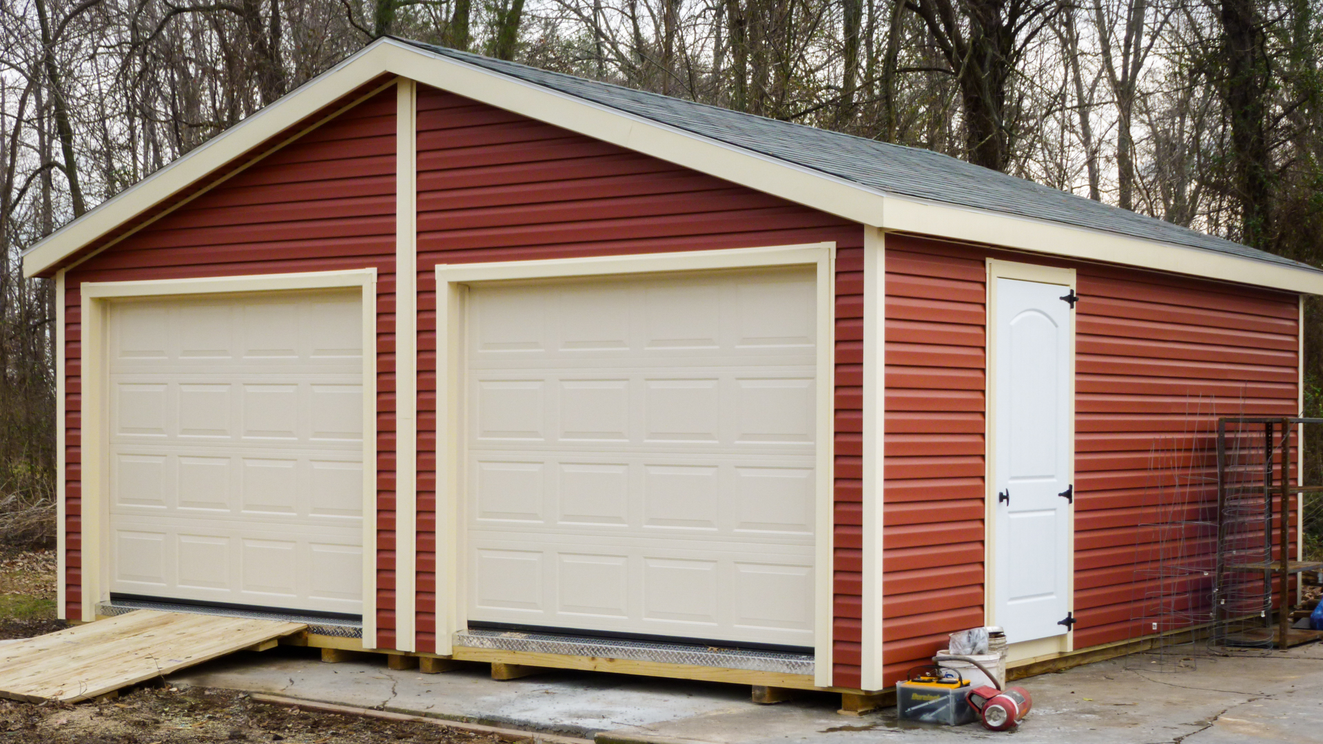 exterior of red car garage shed for sale at PA - Esh's Utility Buildings